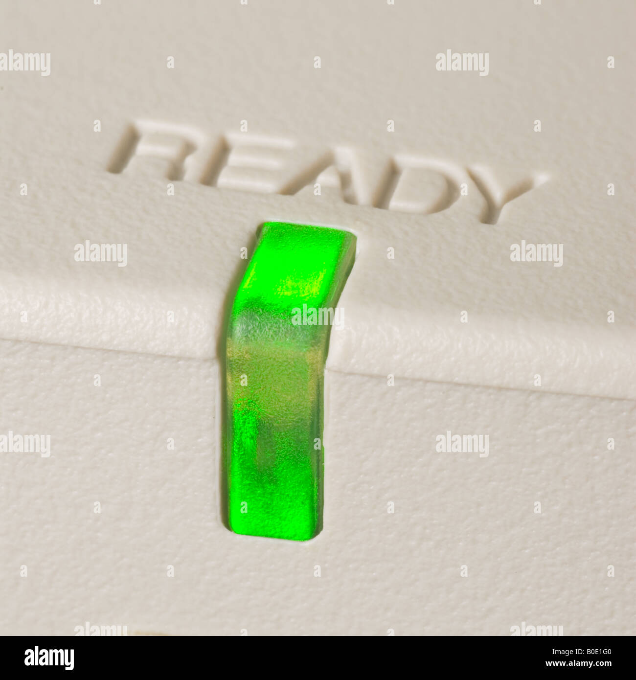 a green illuminated ready indicator light on a scanner Stock Photo - Alamy