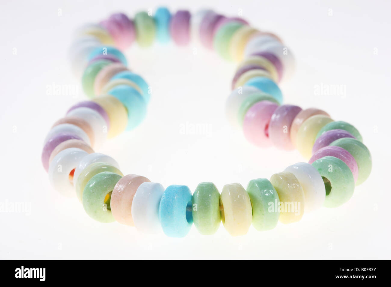 Sweets Chain of colored candys Stock Photo - Alamy