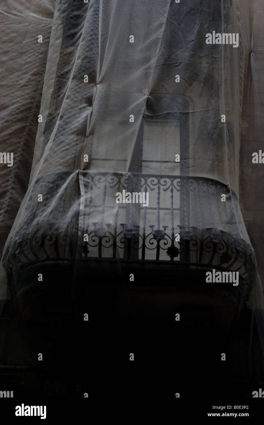 Netting over a building undergoing restoration work, Barcelona ...