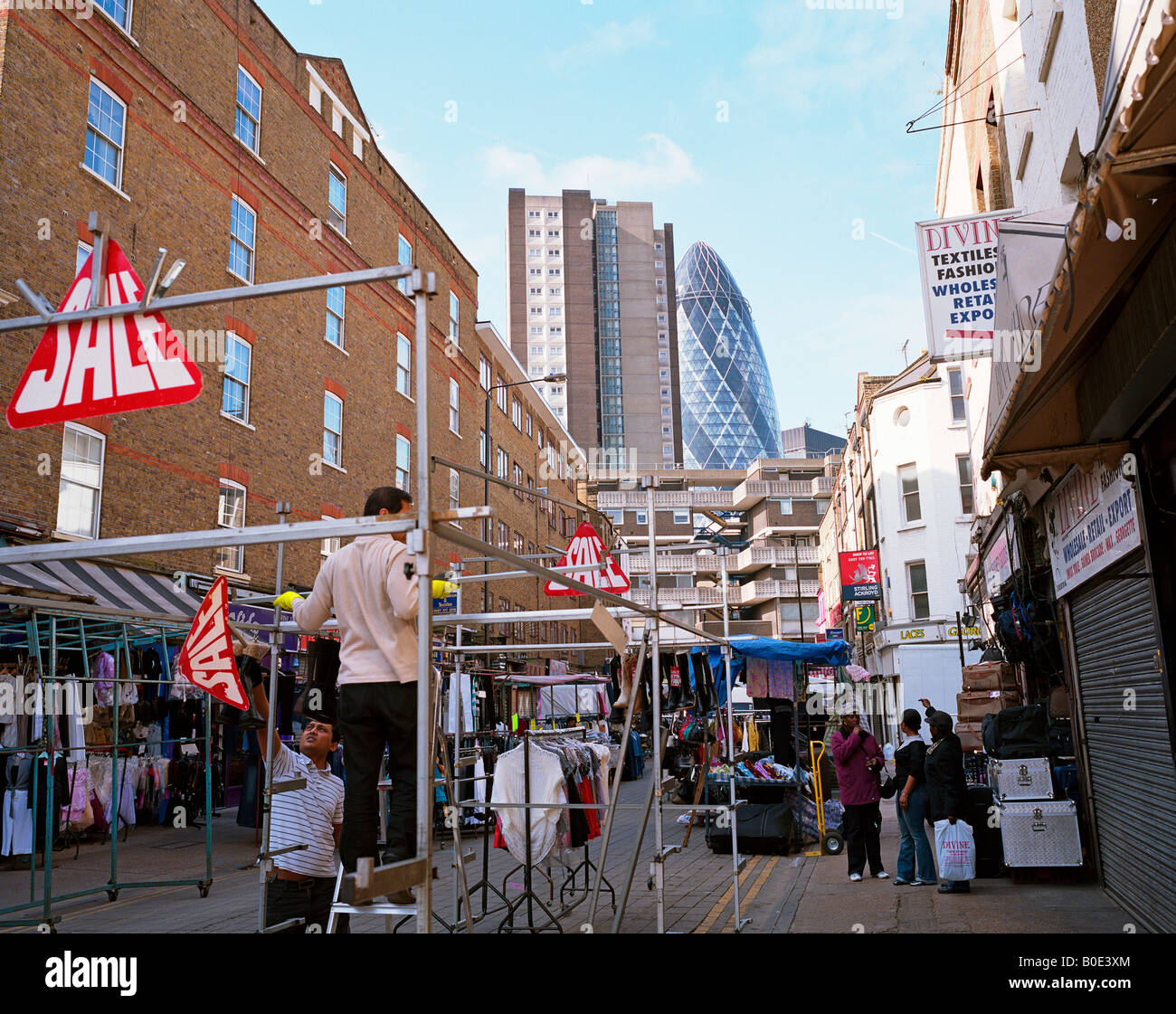 Market traders set up their stalls on Petticoat Lane market in the ...