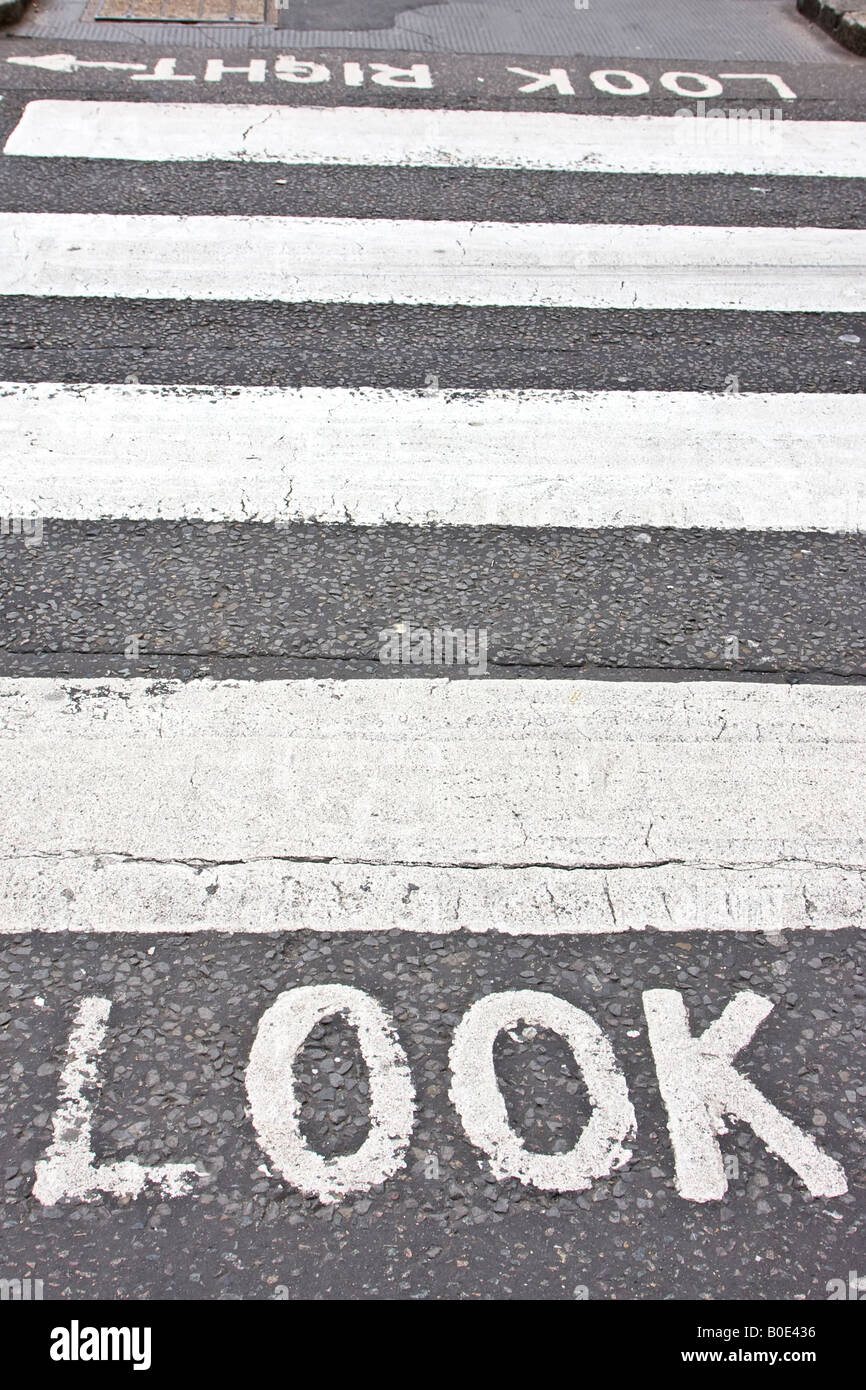 Pedestrian crossing look sign over asphalt Stock Photo - Alamy
