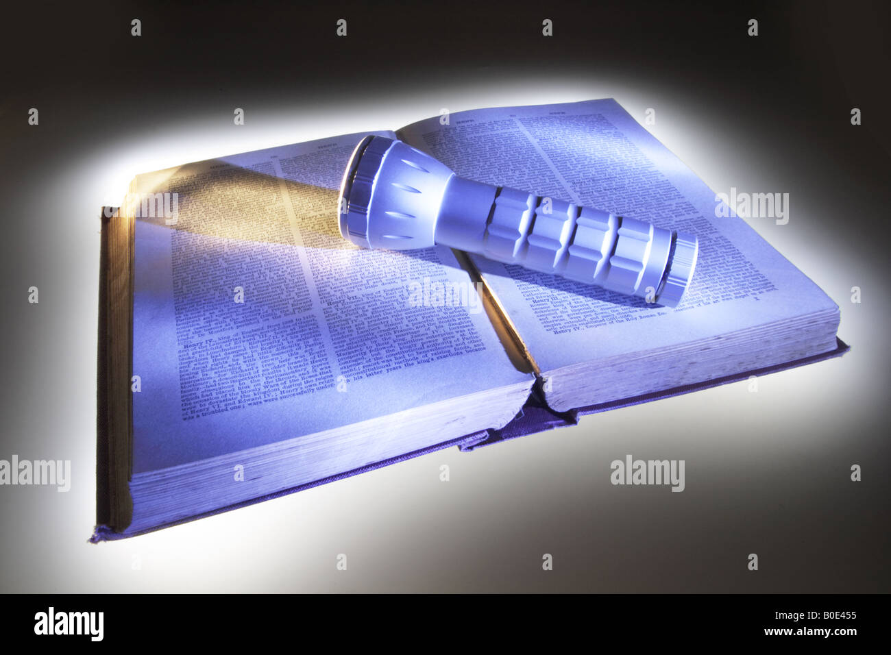 Torch on Book Stock Photo - Alamy