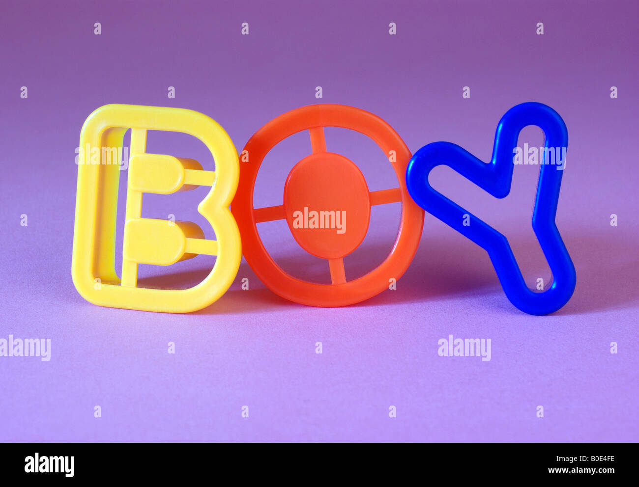 Boy spelt out with plastic letters Stock Photo - Alamy