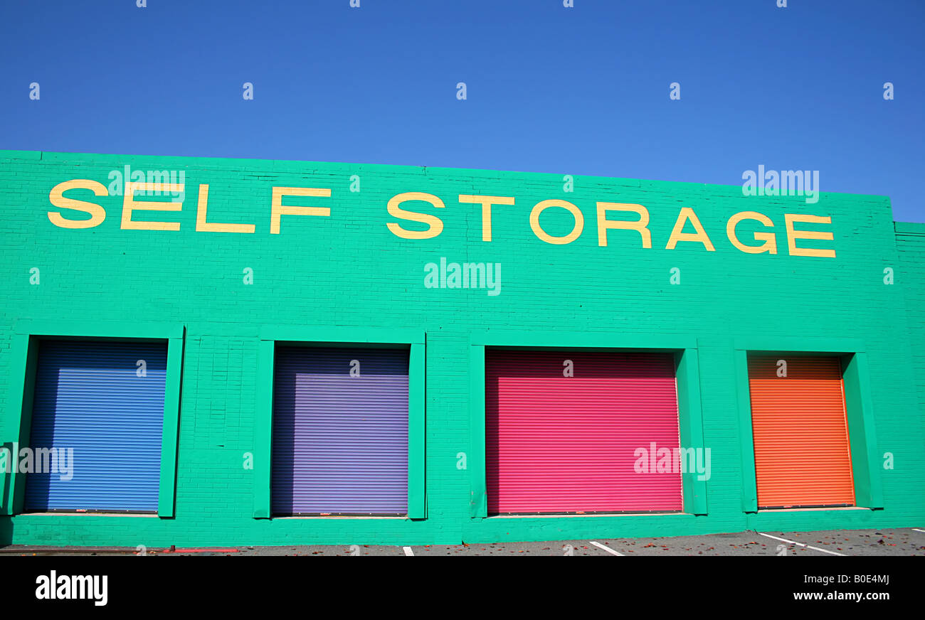 Colorful self storage warehouse with blue sky in background Stock Photo ...