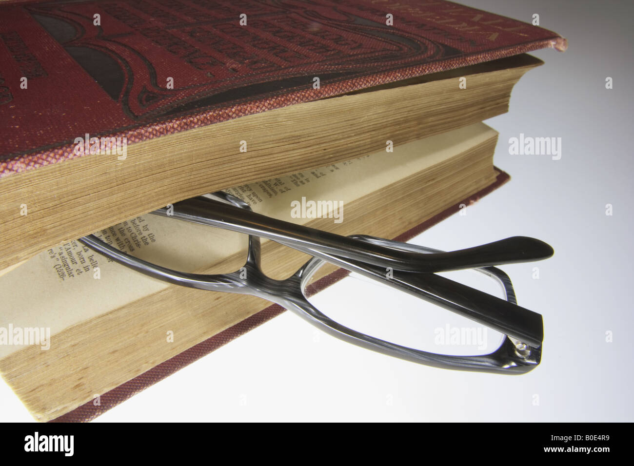 Old Book with Eyeglasses Stock Photo - Alamy