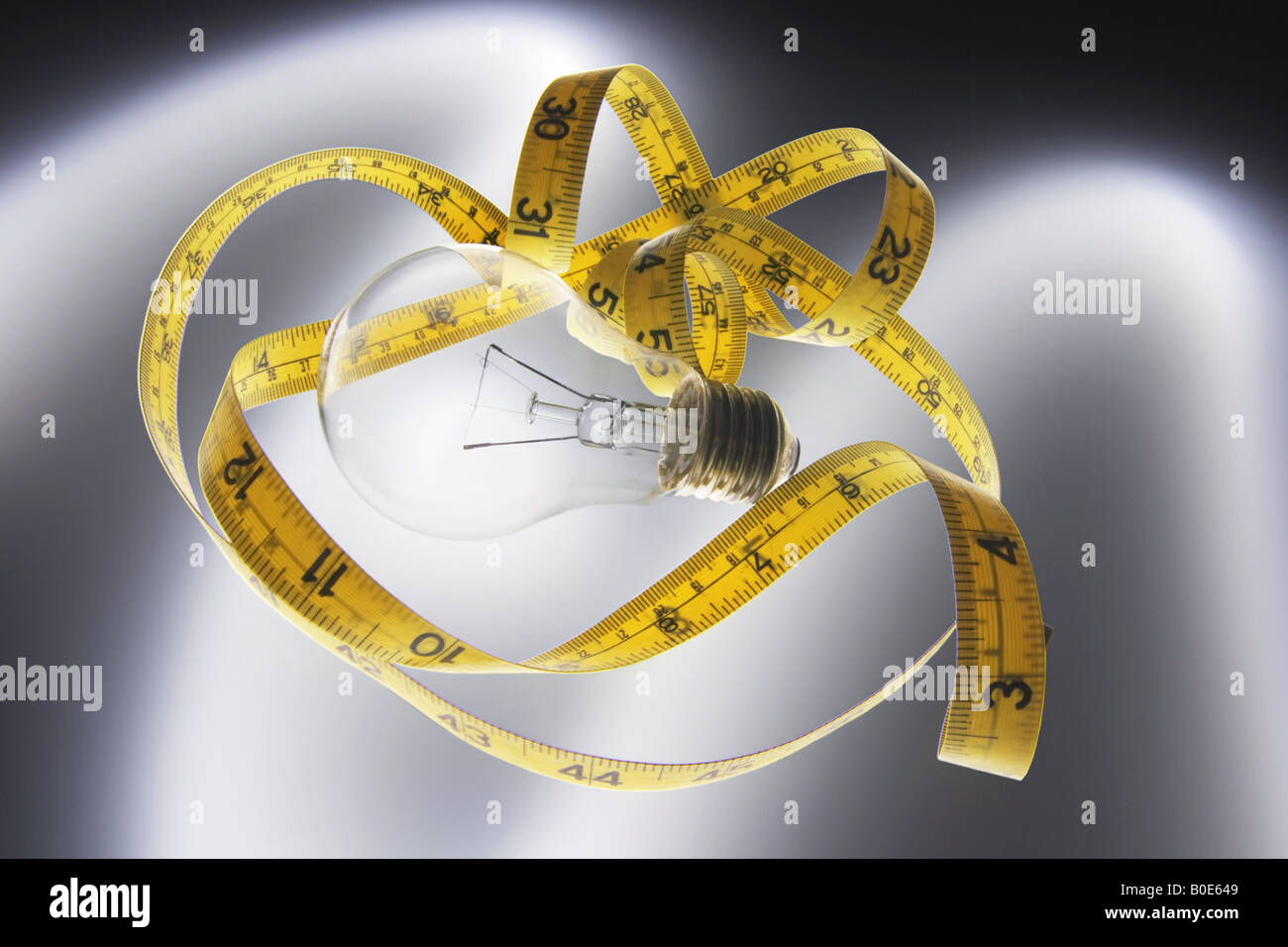Light Bulb with Tape Measure Stock Photo - Alamy