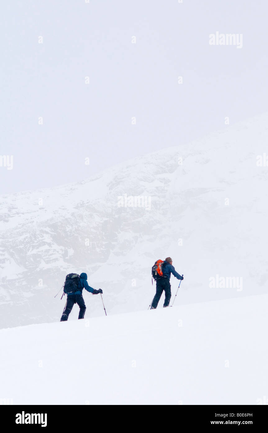 Two skiers skinning up the Seven Steps to Paradise on the Asulkan ...