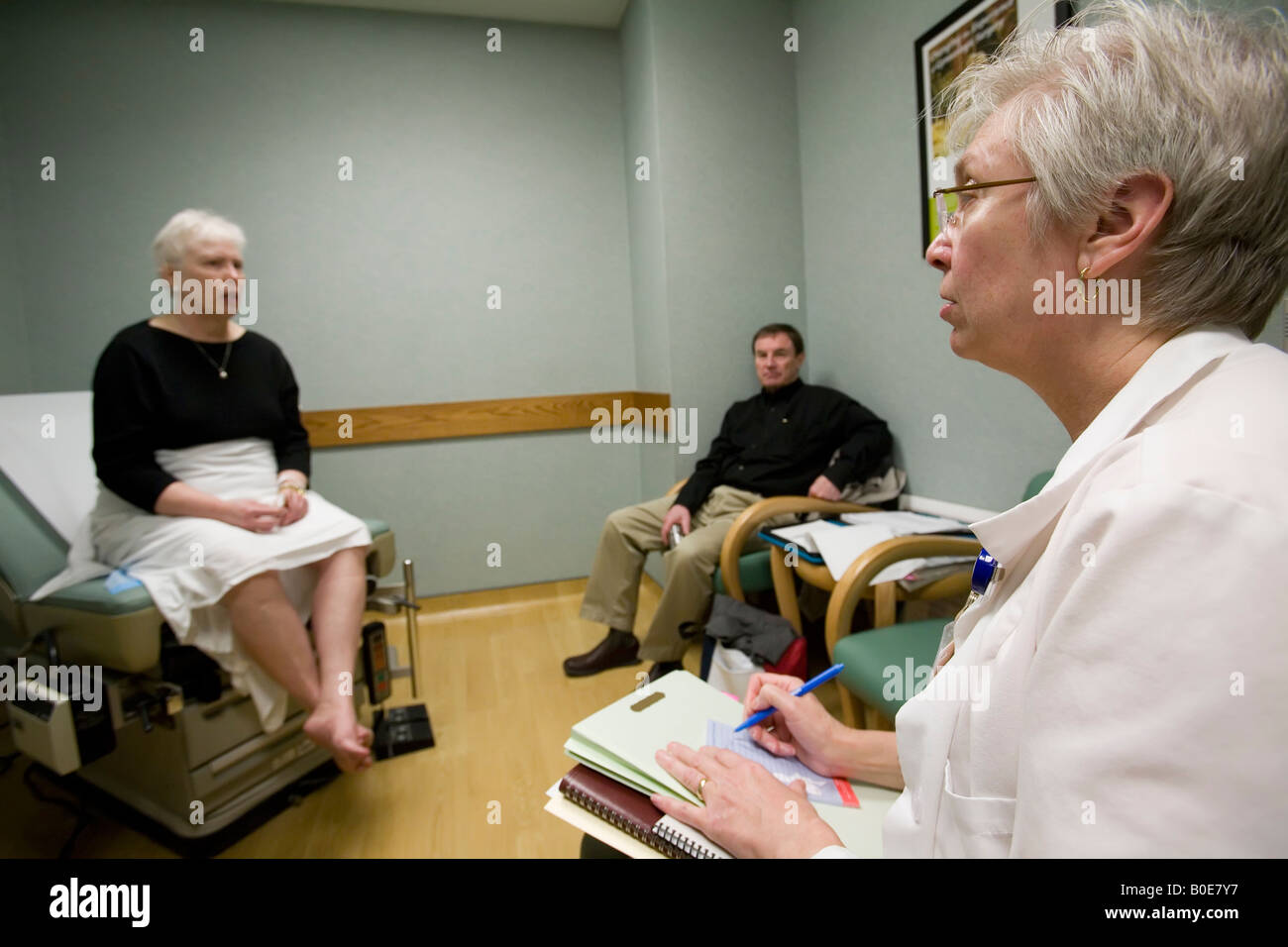 Research nurse talks to patient participating in clinical trial of new ...