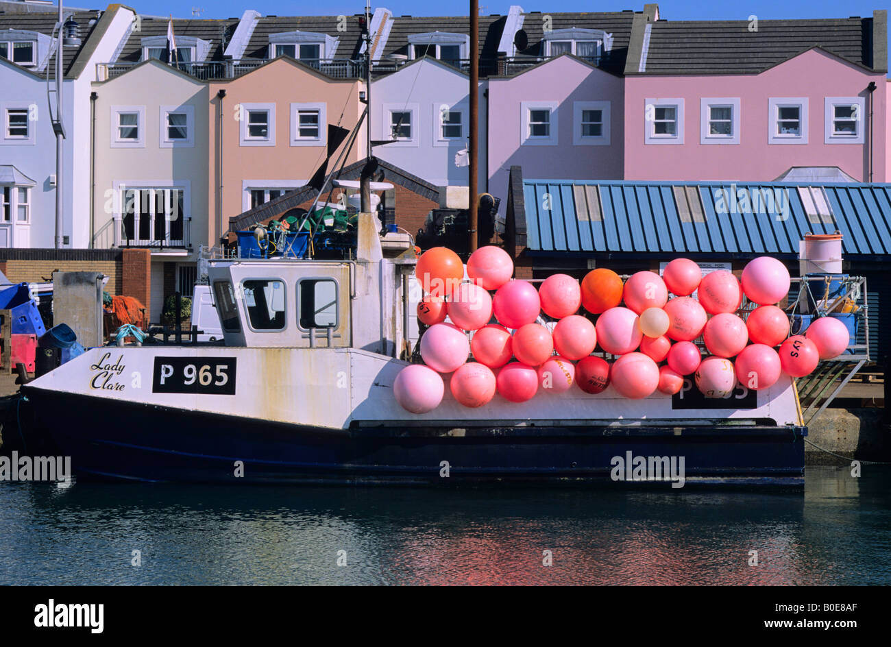 Fishing boat with pink and orange floats, Old Portsmouth harbour ...