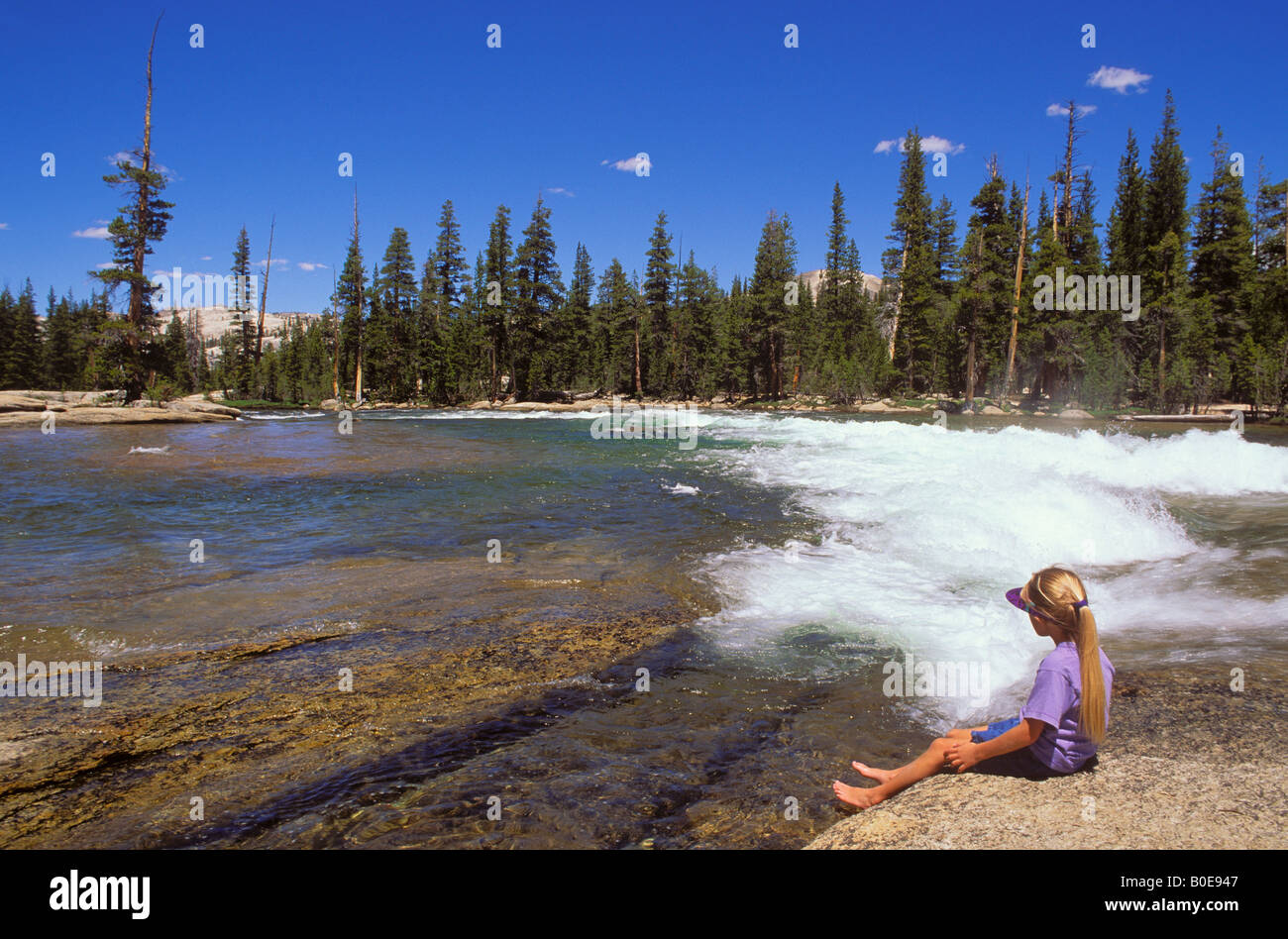 Girl watching cascade from the banks of the Tuolumne River Tuolumne ...