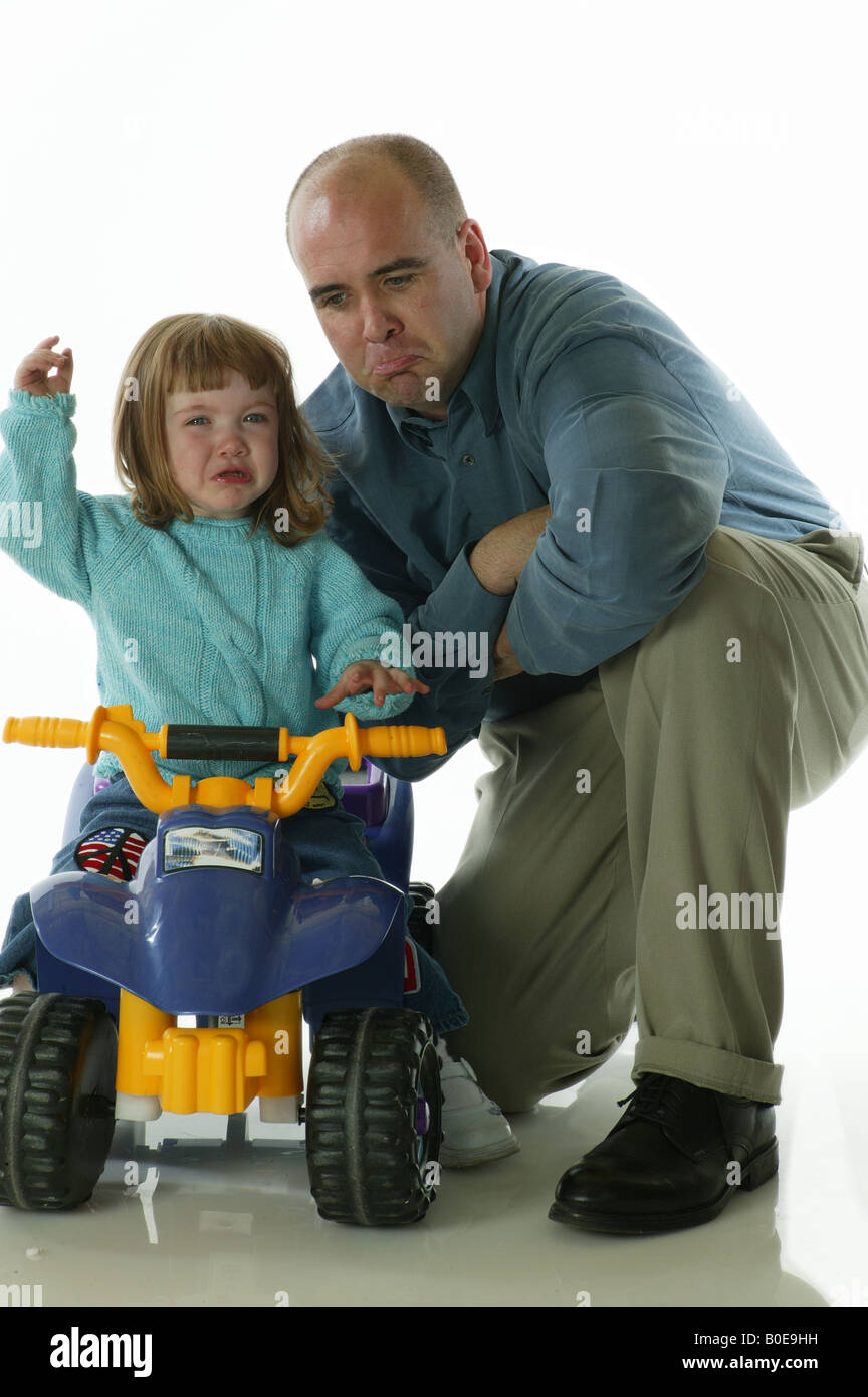 Mid adult man crying with his daughter Stock Photo - Alamy