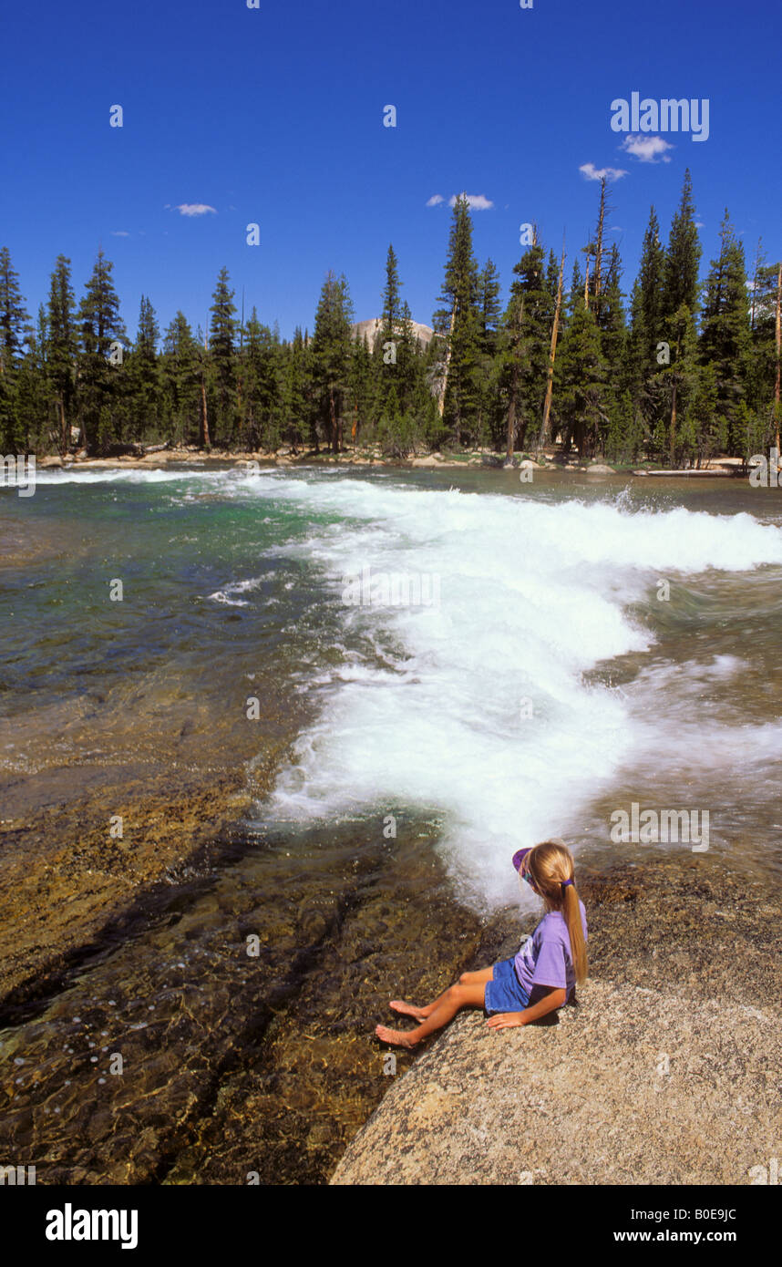 Girl watching cascade from the banks of the Tuolumne River Tuolumne ...