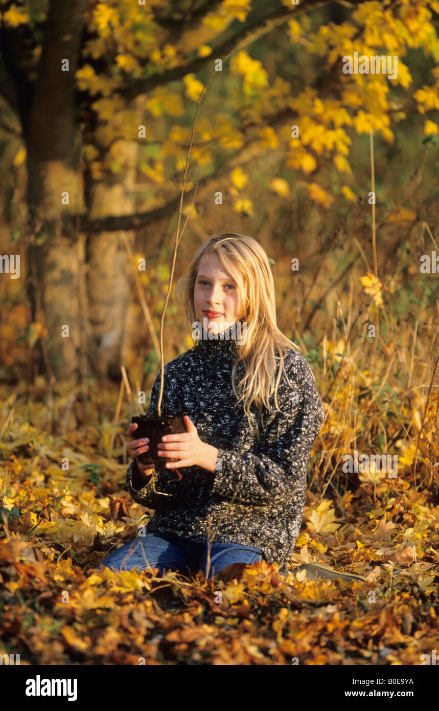 Girl planting tree hi-res stock photography and images - Alamy