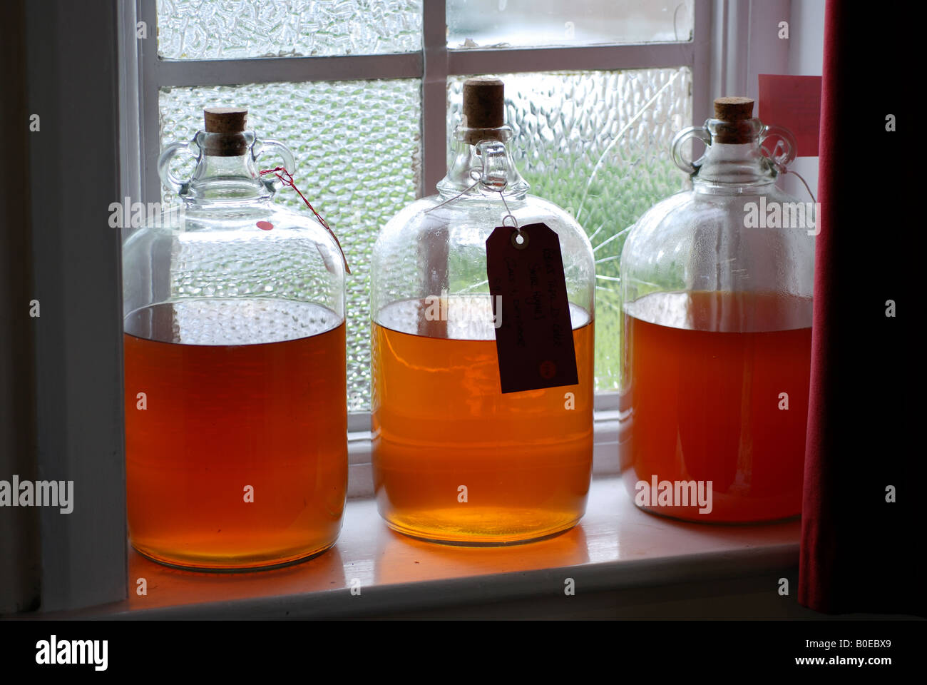 Demijohns of cider Stock Photo - Alamy