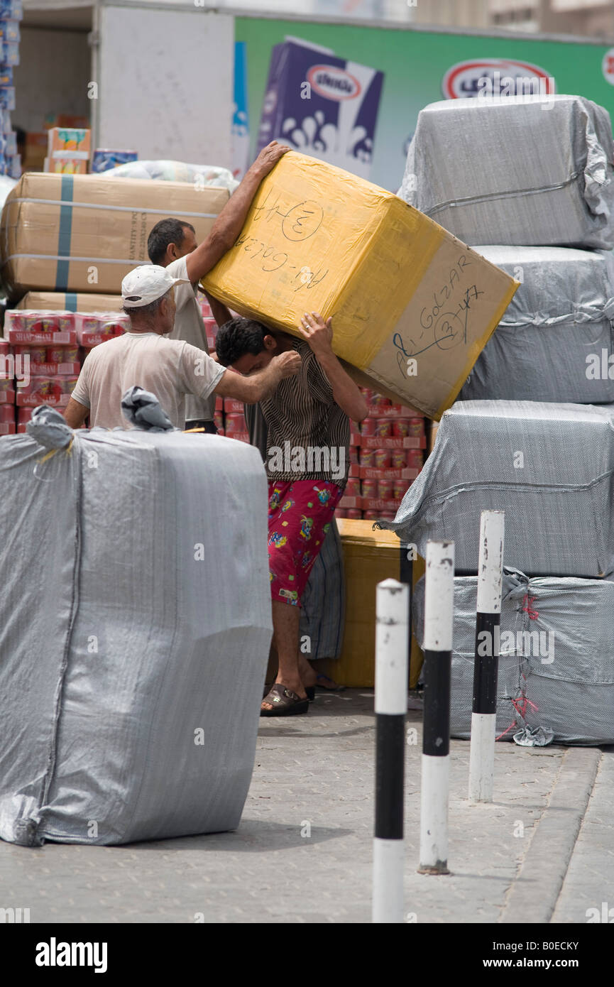 Men carry heavy burden hi-res stock photography and images - Alamy
