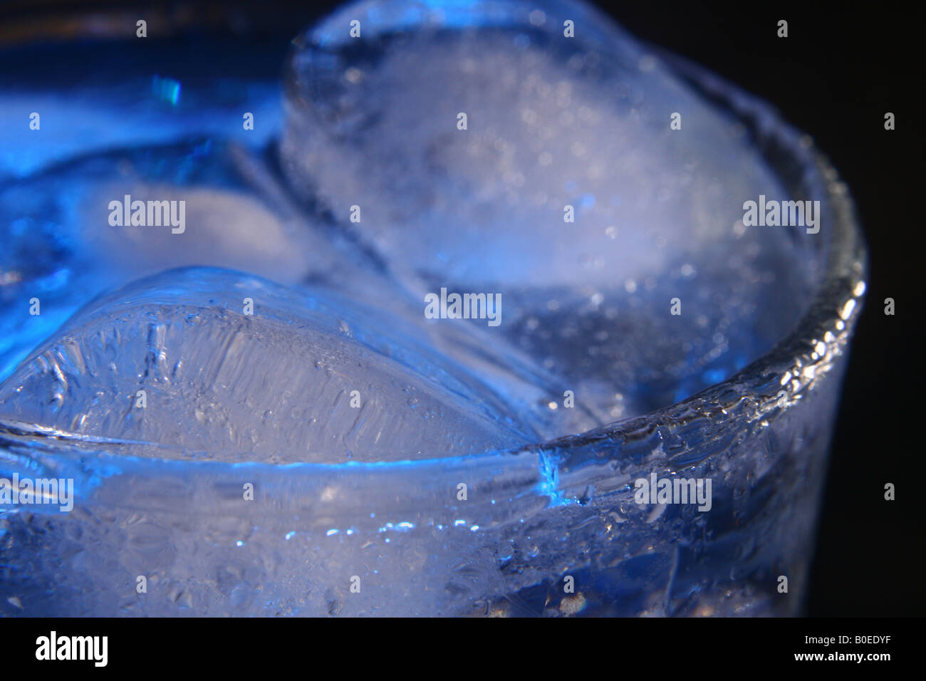 Ice cubes floating in a glass Stock Photo - Alamy