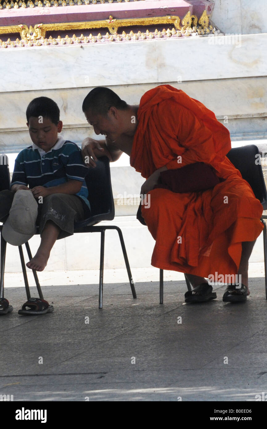 monk talkin with young boy, wat arun(temple of dawn Stock Photo - Alamy