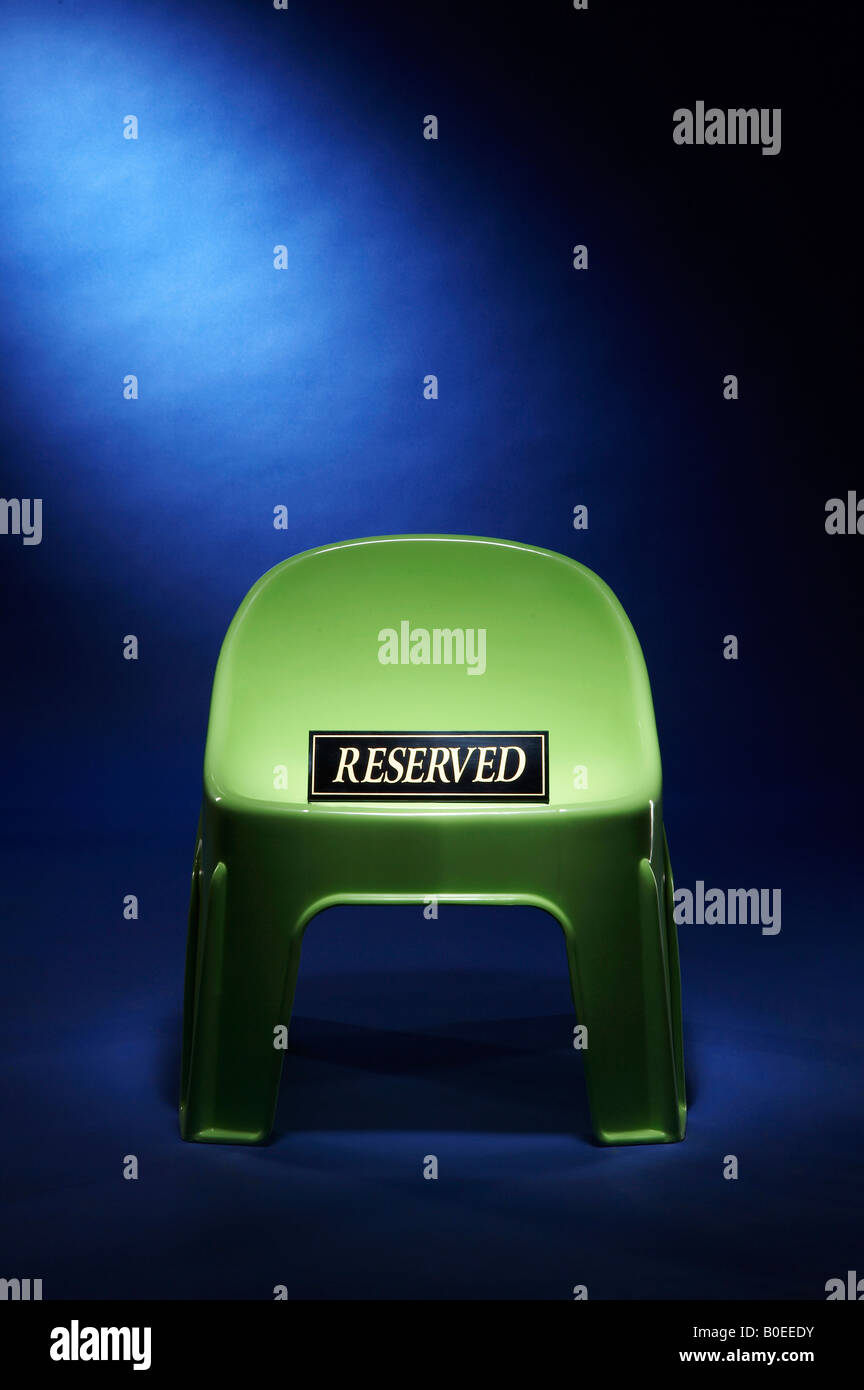 Reserved sign at green stool Stock Photo - Alamy