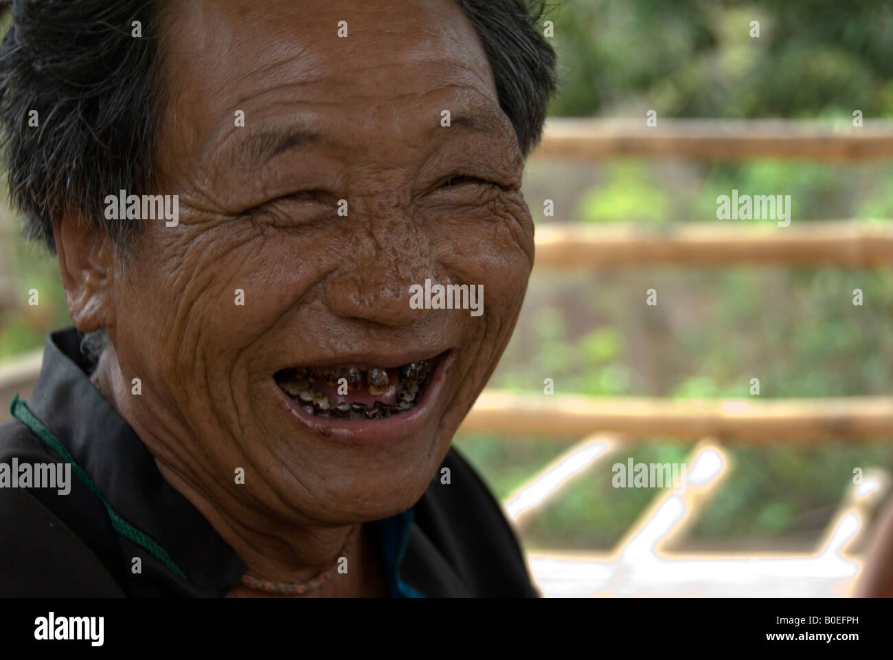 Happy Lahu hill tribe man laughing Stock Photo - Alamy