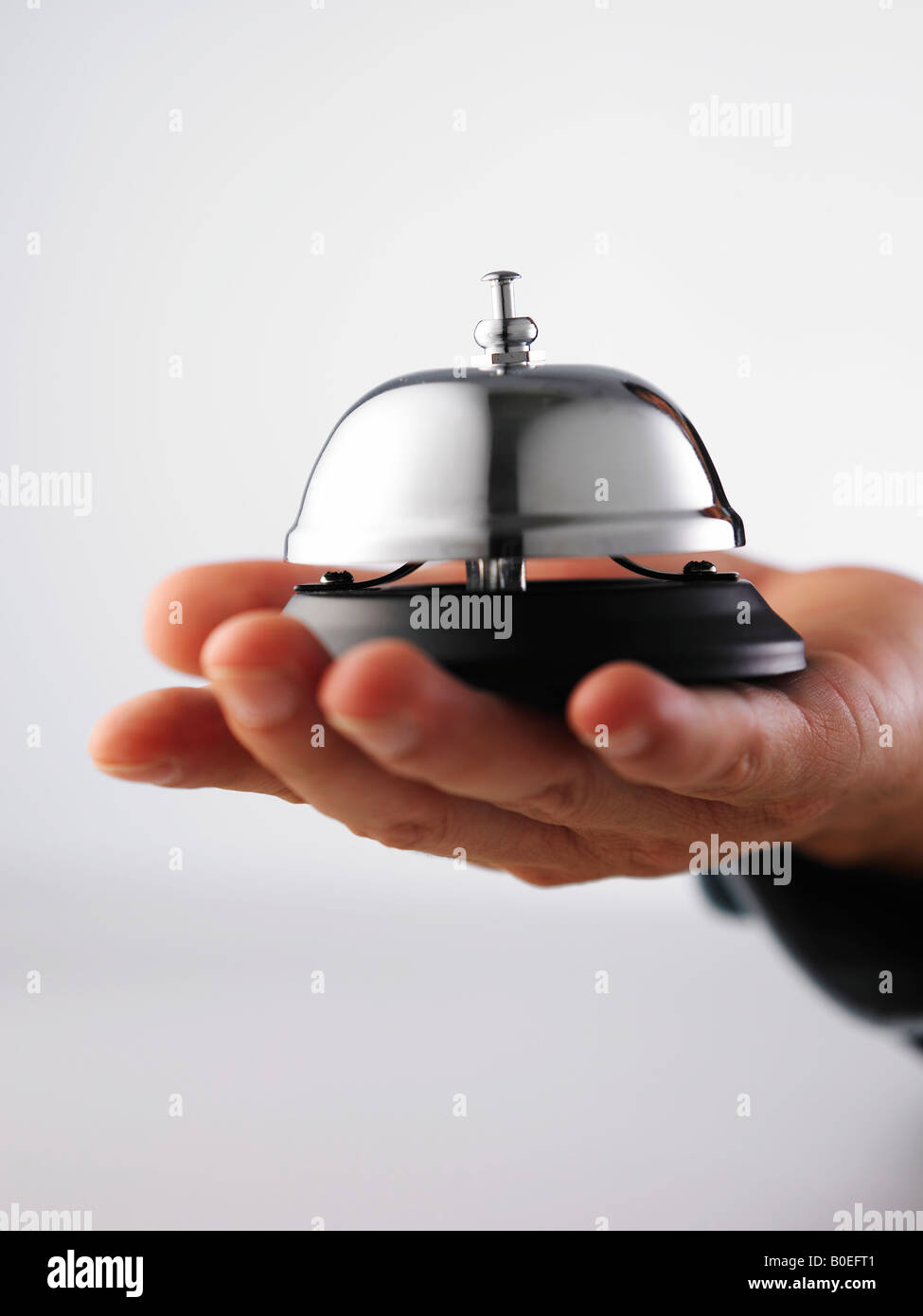Call bell on a palm Stock Photo - Alamy