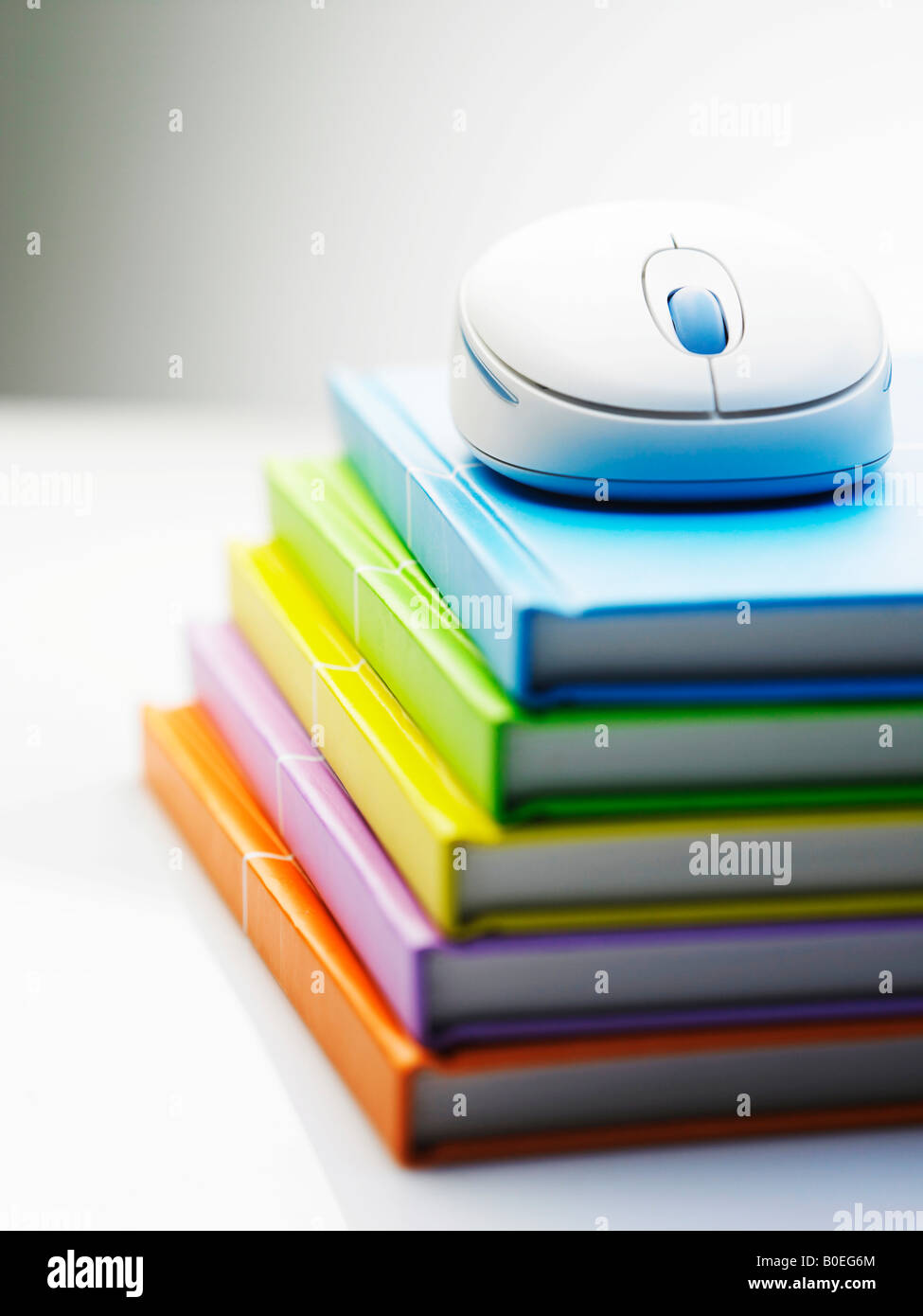 MIce with wheel on a stack of books Stock Photo - Alamy