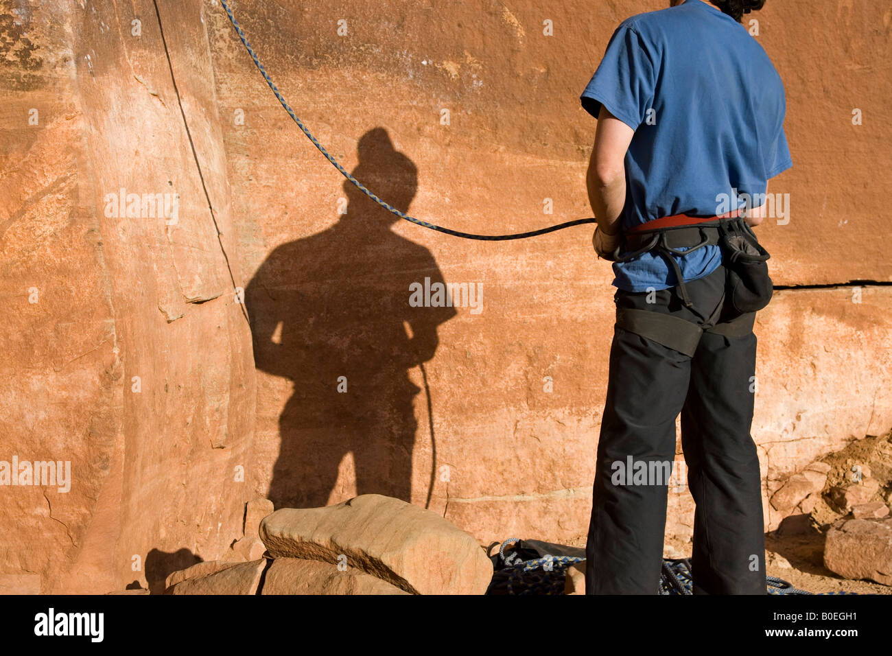 Shadow of man belaying a rock climber in Indian Creek Utah Stock Photo ...