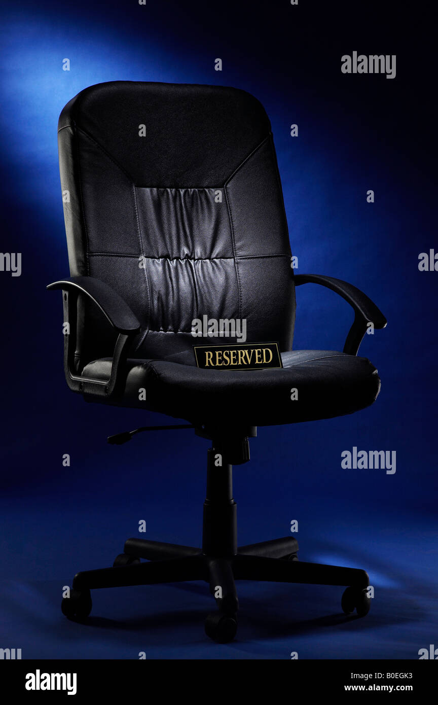 Black office chair with the reserved sign Stock Photo - Alamy