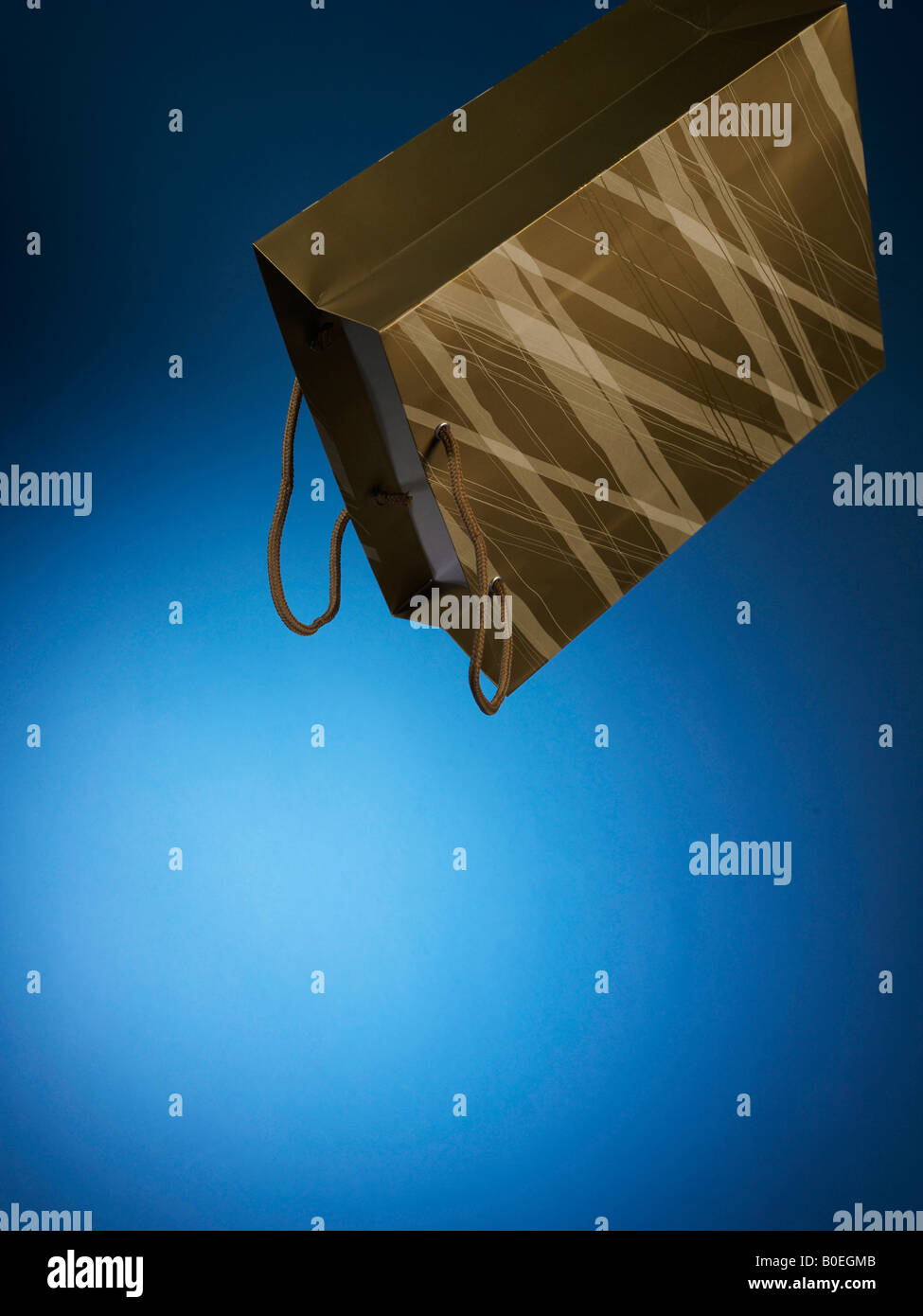 Coloured paper bag being flip over Stock Photo - Alamy