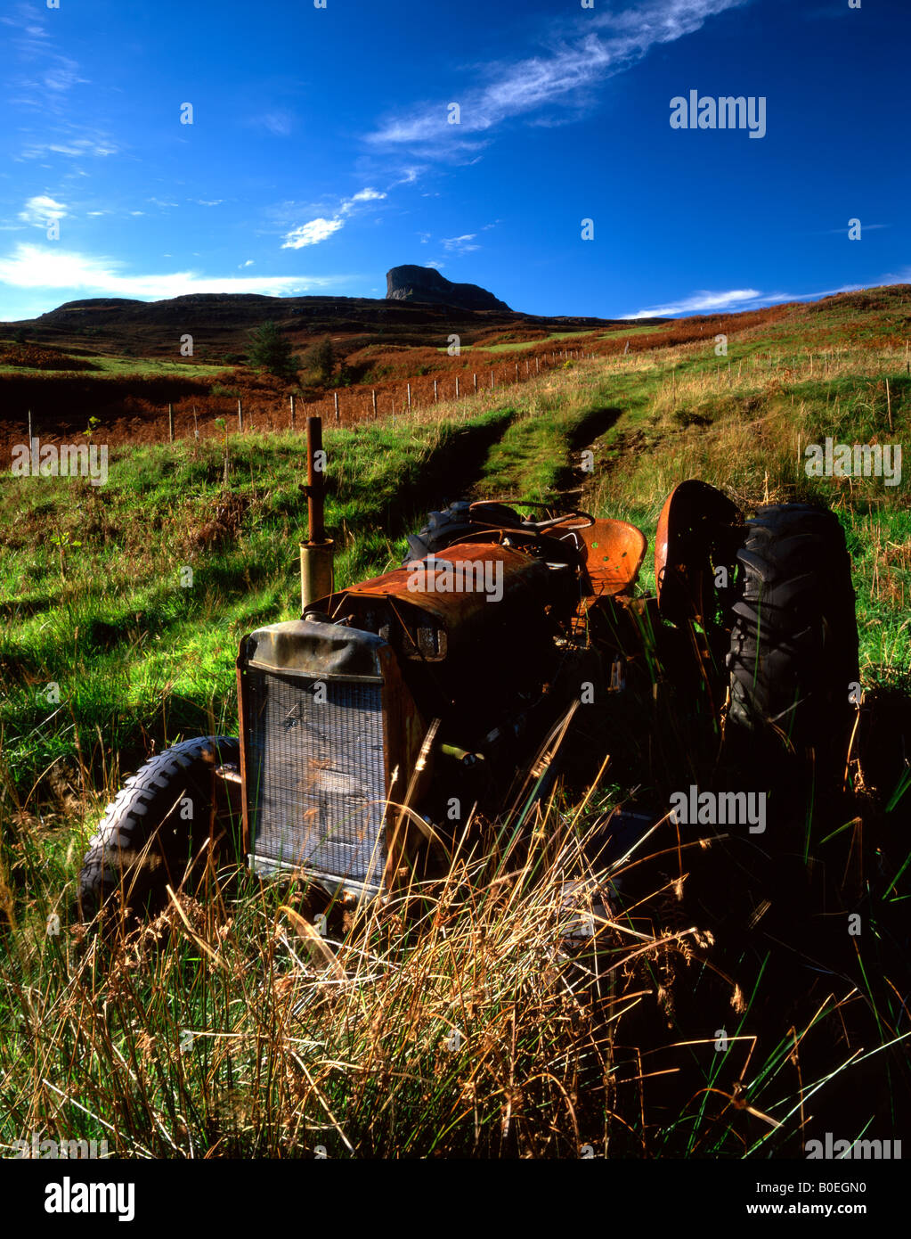 Abandoned tractor beneath An Sgurr, Isle of Eigg, Scotland, UK Stock ...