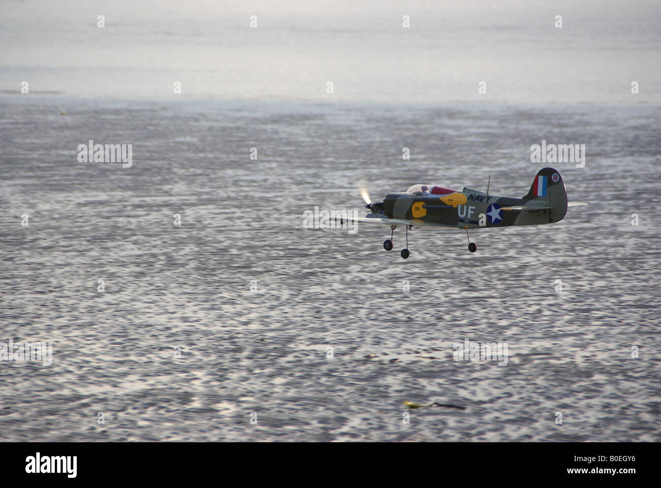 Aircraft is flying low over the beach hi-res stock photography and ...