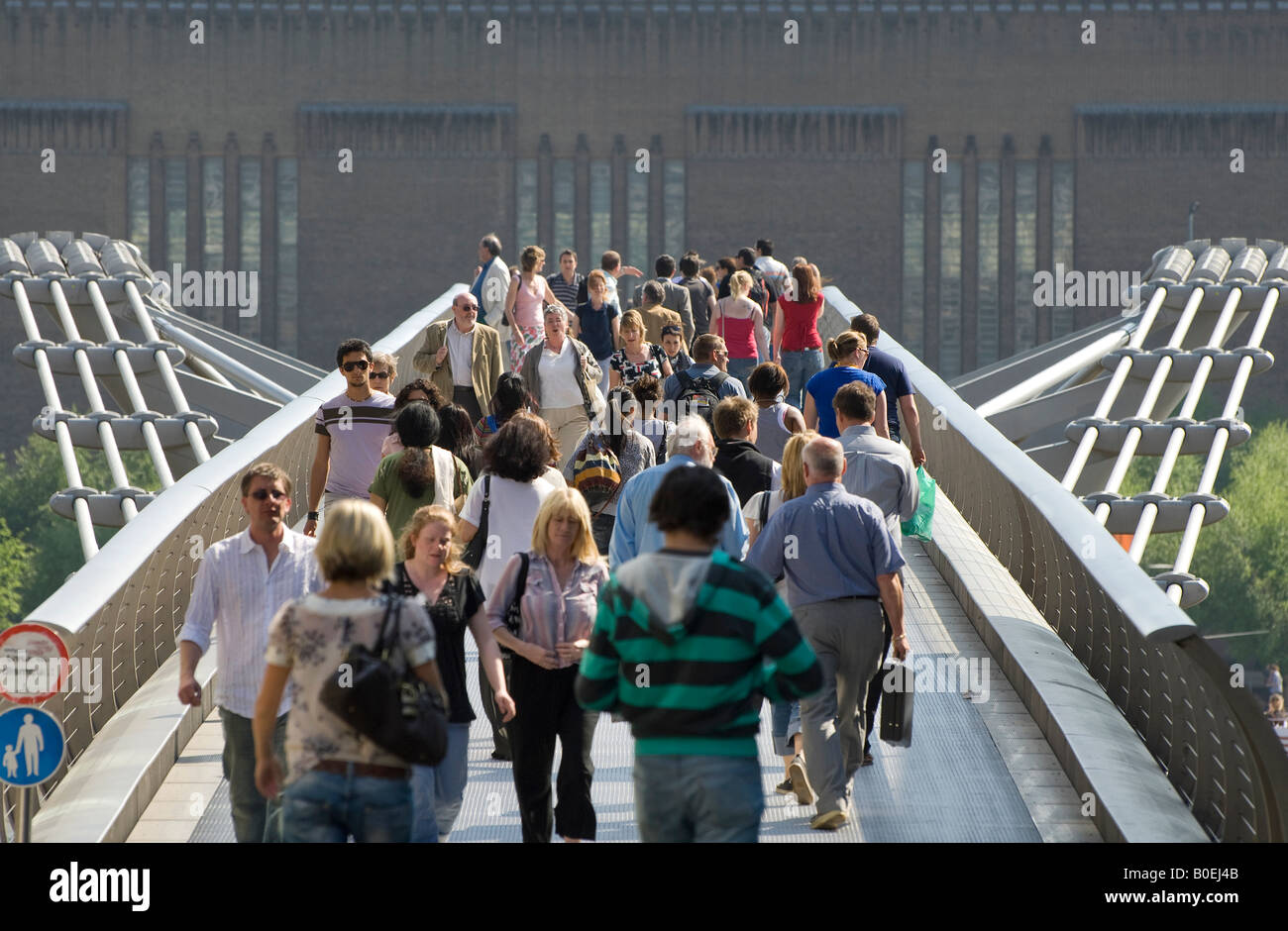 people walking across the millennium bridge, london, england Stock ...