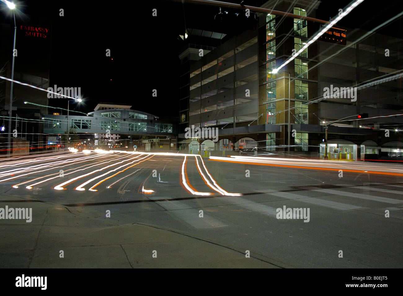 Long exposure of street. Headlights and streetlights and crosswalk ...