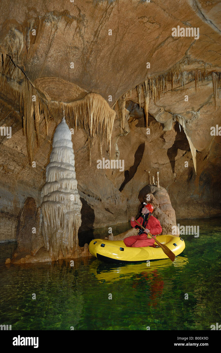 Caver exploring cave Stock Photo - Alamy