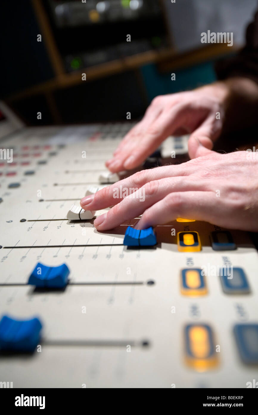 Working Hands on a music soundboard Stock Photo - Alamy