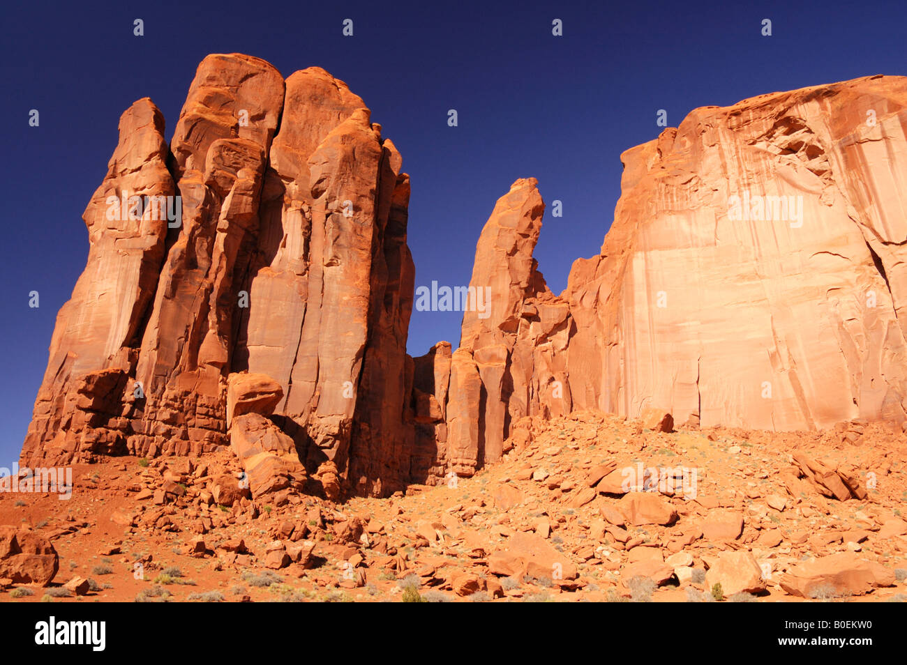 Red rocks against deep blue morning sky in Monument Valley Navajo ...