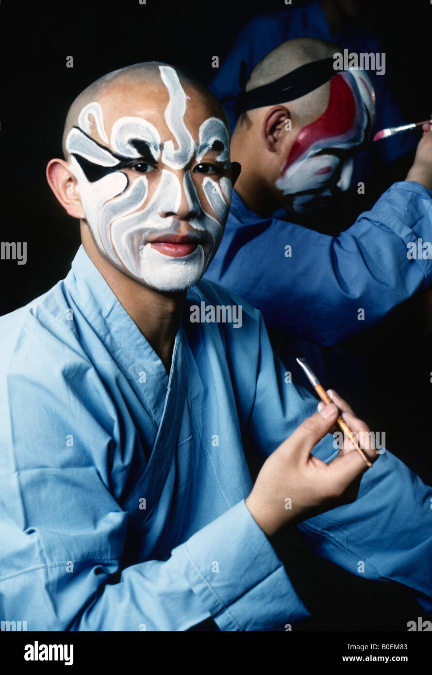 Beijing Opera performers applying grease paint makeup backstage Stock ...