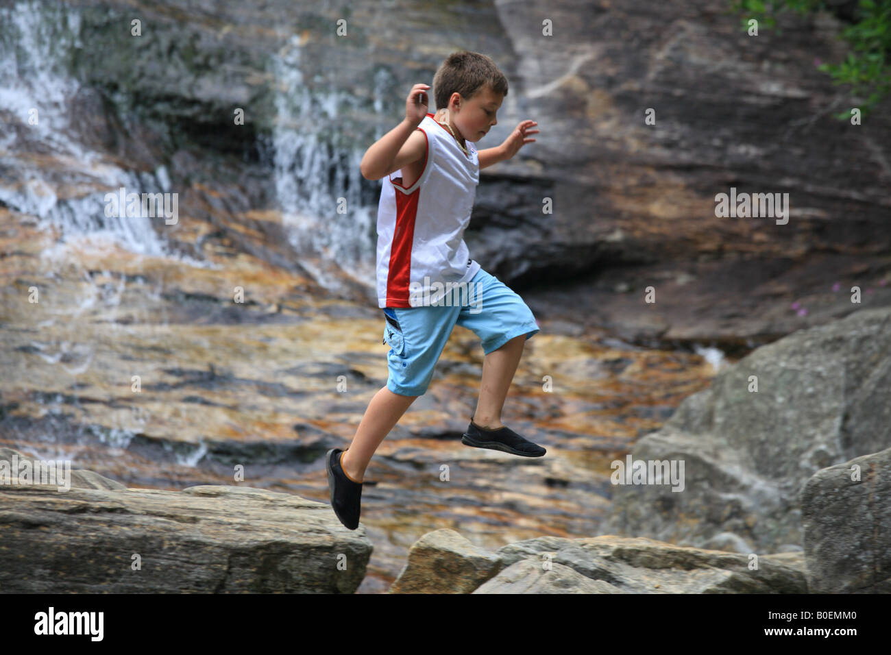 Children jumping of rock hi-res stock photography and images - Alamy