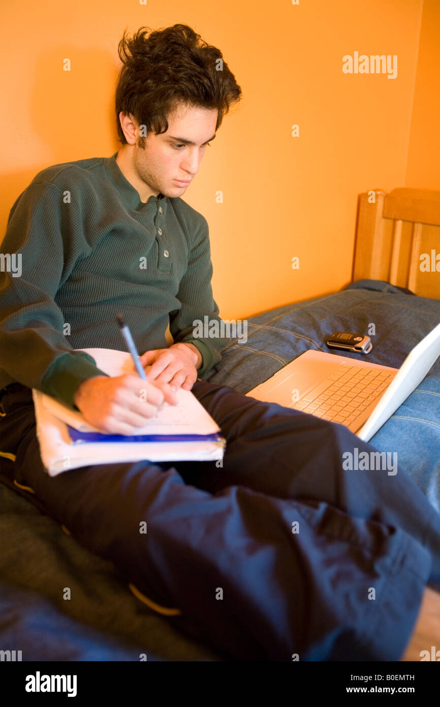 Teenager writing a project hi-res stock photography and images - Alamy