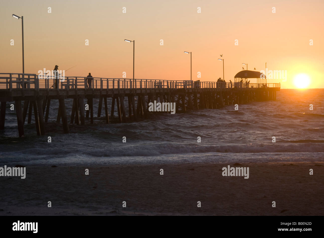 Fishing at sunset off the Henley Jetty, South Australia Stock Photo - Alamy