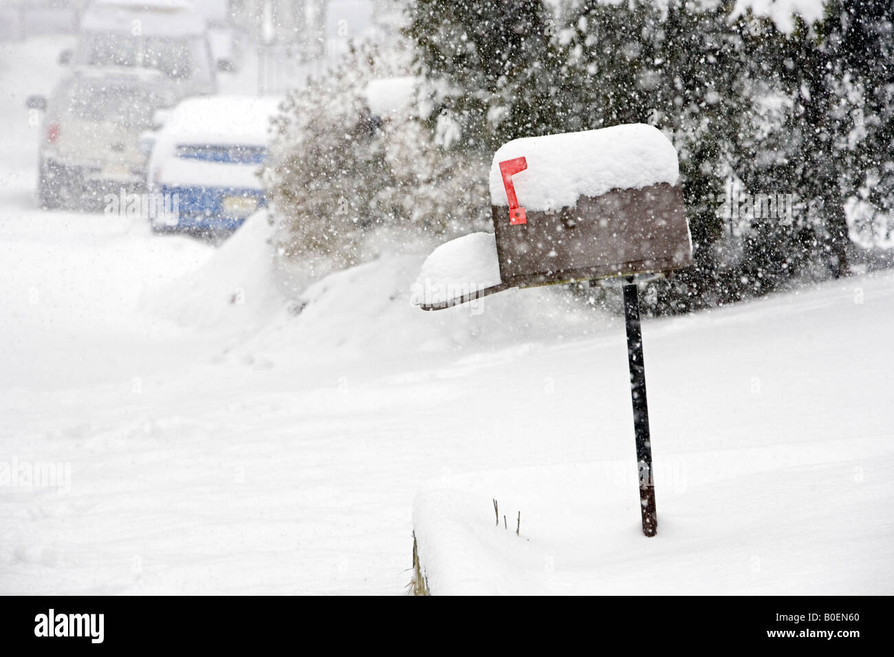 A mailbox covered with snow during winter Stock Photo - Alamy
