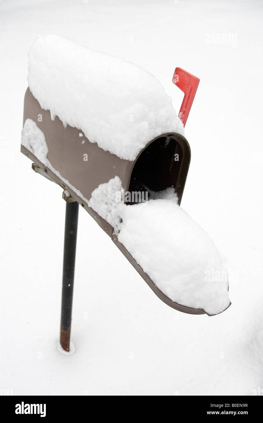 A mailbox covered with snow during winter Stock Photo - Alamy