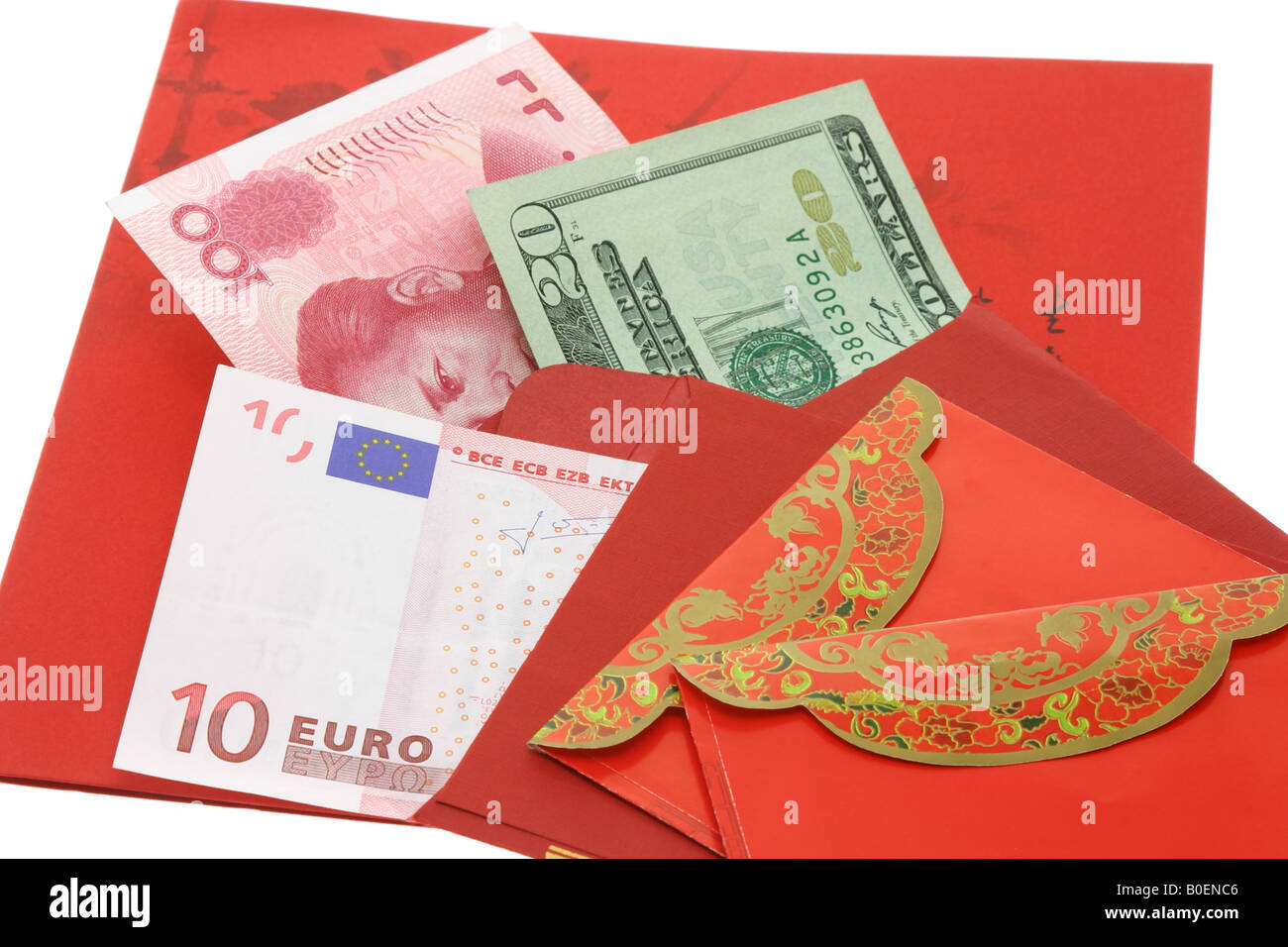 Chinese New Year red packets and currency notes on white background ...