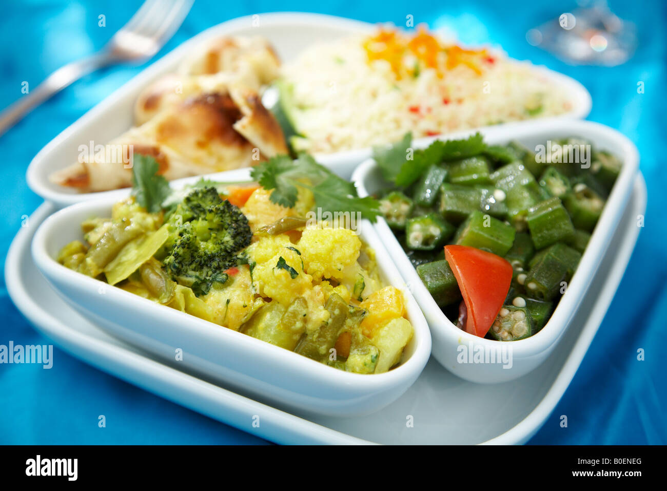 Indian set lunch meal, potato curry, ocra, rice and naan bread Stock Photo - Alamy
