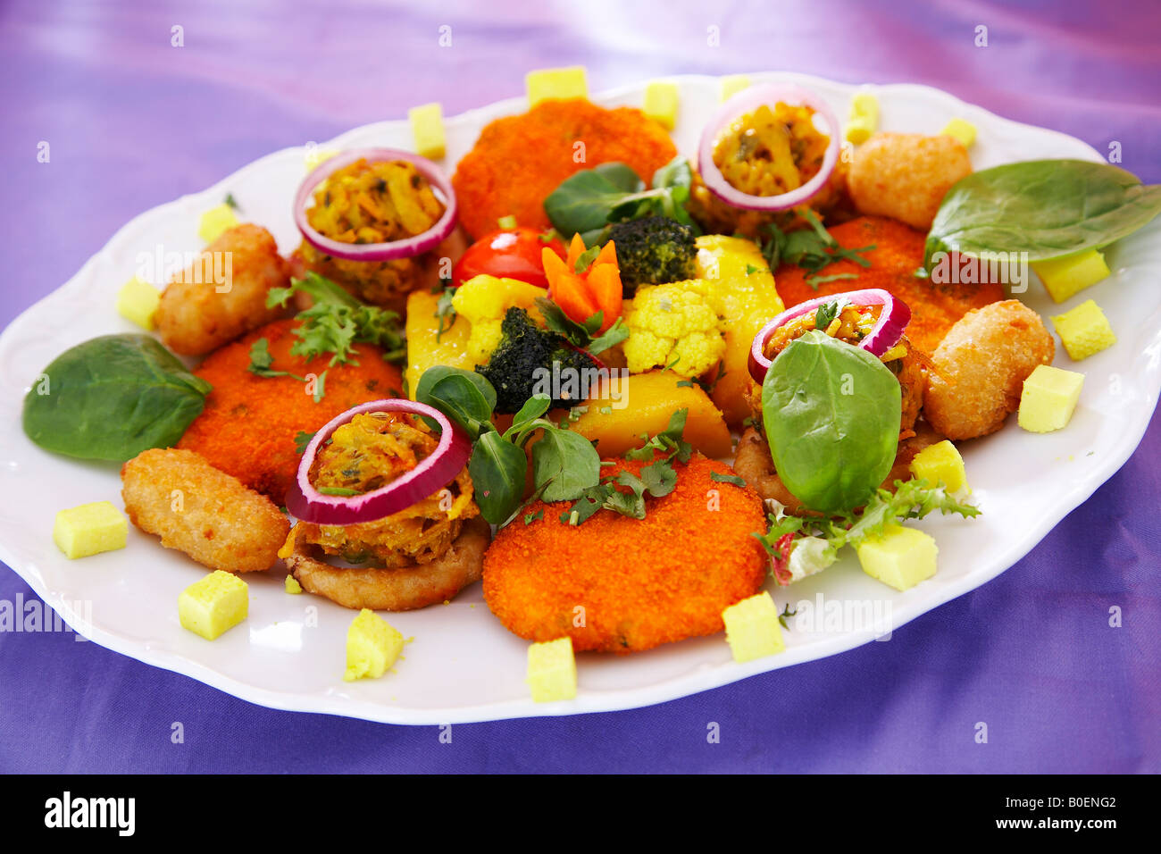 Indian vegetable platter, onion bhajee, vegetable samosa, Aloo gobi ...