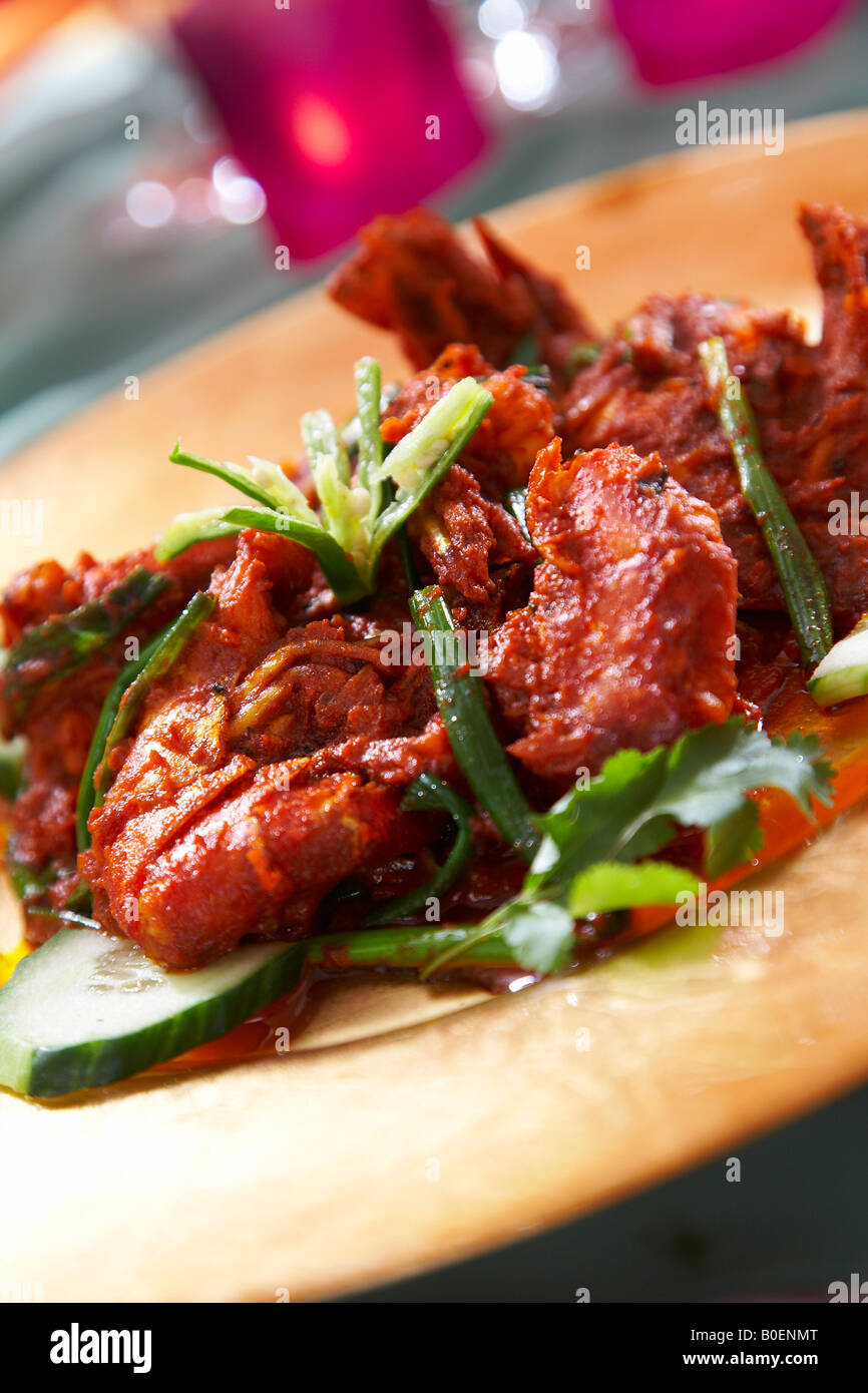 Curried Tiger King Prawns on a plate in a restaurant Stock Photo - Alamy