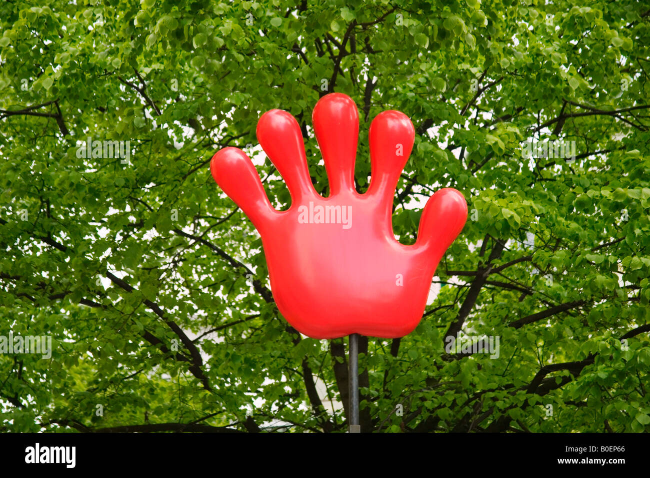 Sculpture of a big red hand on the street Warsaw Poland Stock Photo - Alamy