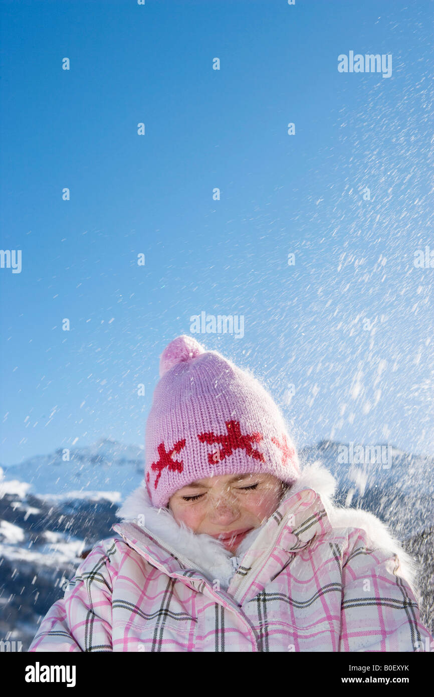 Young girl with snow falling on her Stock Photo - Alamy