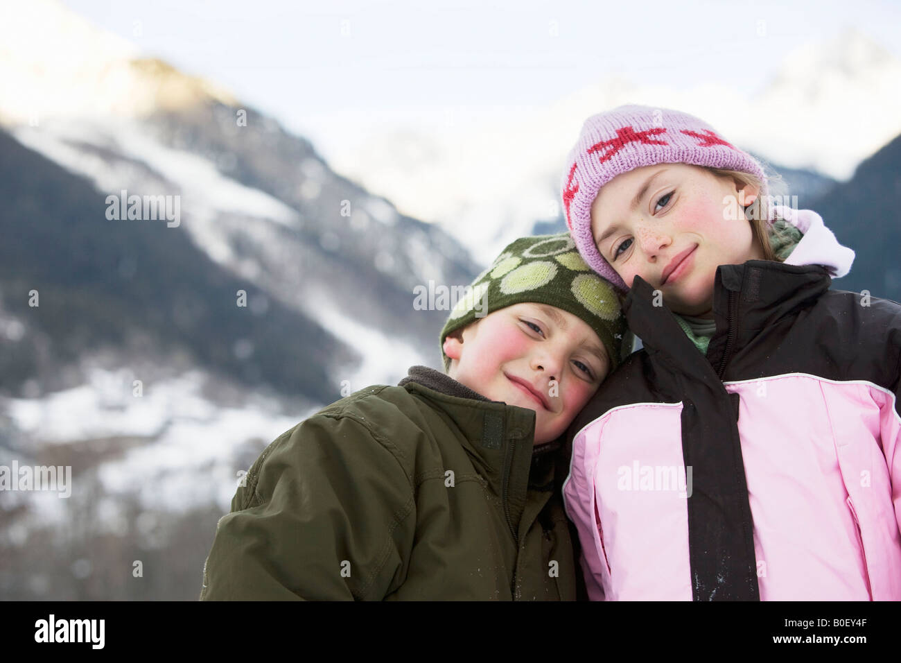 Portrait of boy and girl in mountains Stock Photo - Alamy