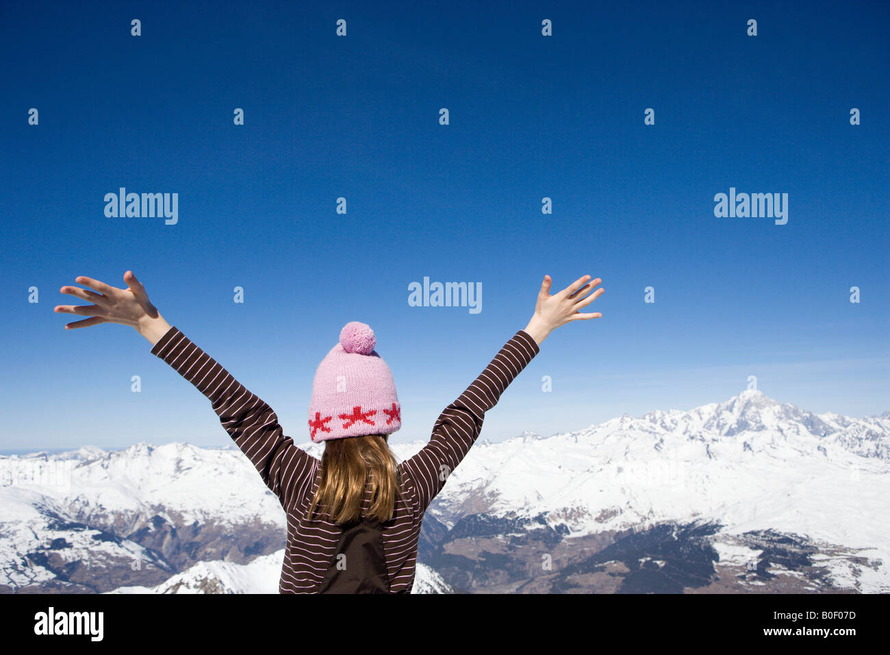 Girl looking at mountains Stock Photo - Alamy