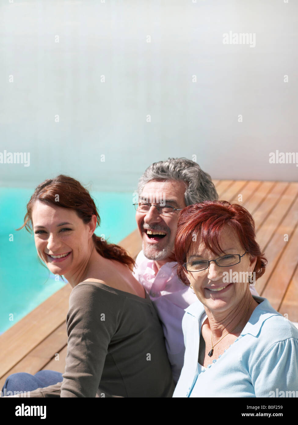 Family Sitting Swimming Pool High Resolution Stock Photography and ...